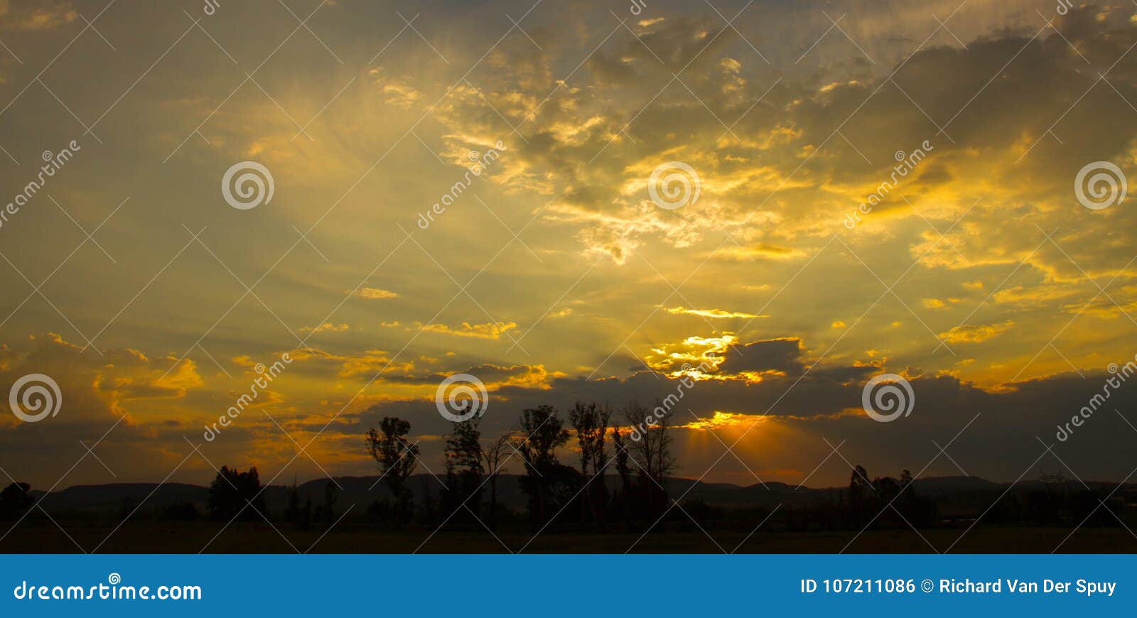 African Landscape with Sunset Clouds and Sunlight Rays Stock Photo ...