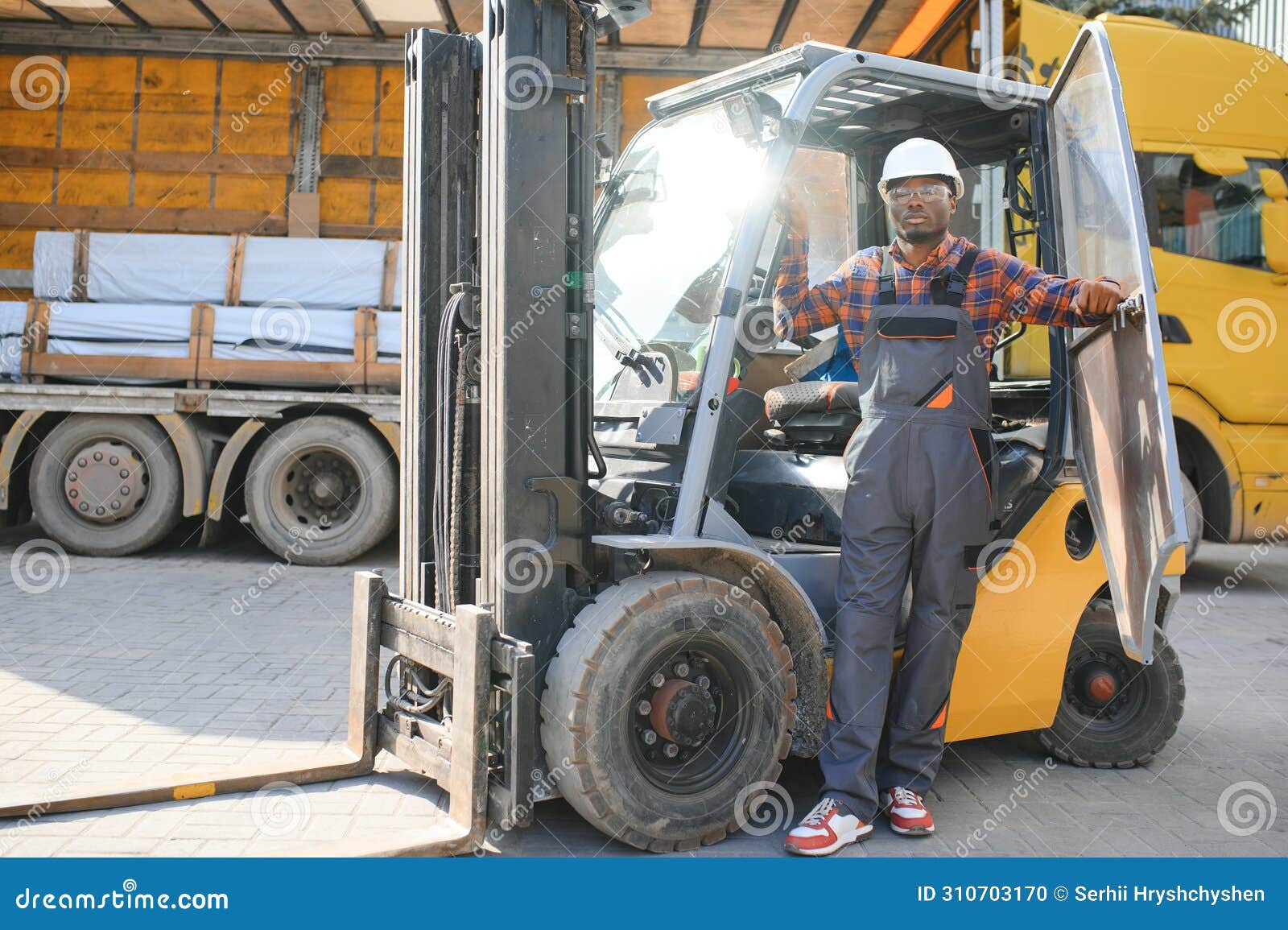 African Logistics Man As a Forklift Driver in the Warehouse of a ...