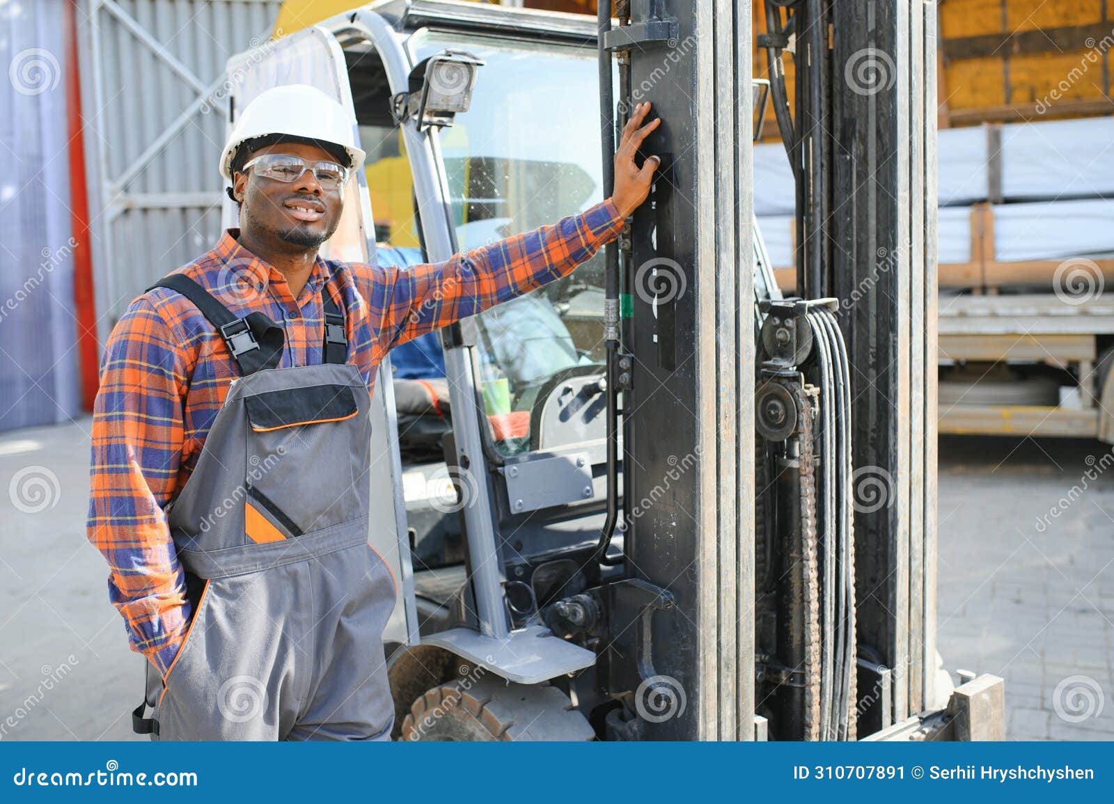 African Logistics Man As a Forklift Driver in the Warehouse of a ...