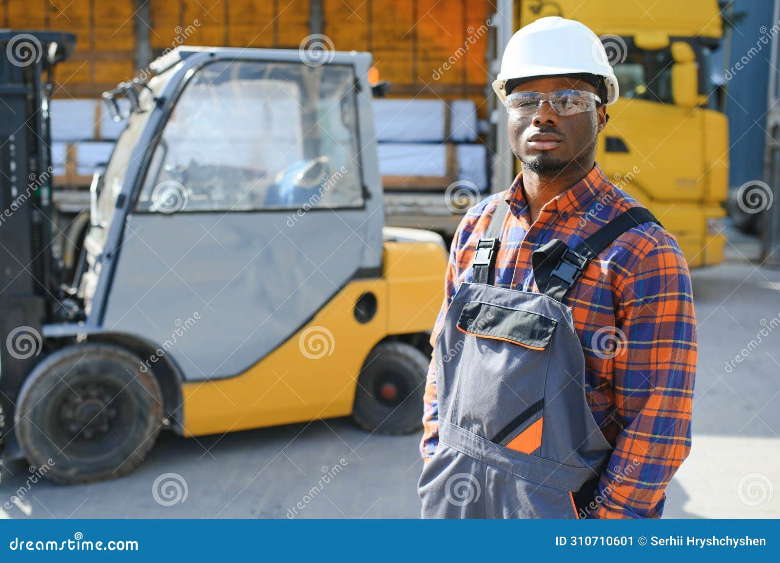 African Logistics Man As a Forklift Driver in the Warehouse of a ...