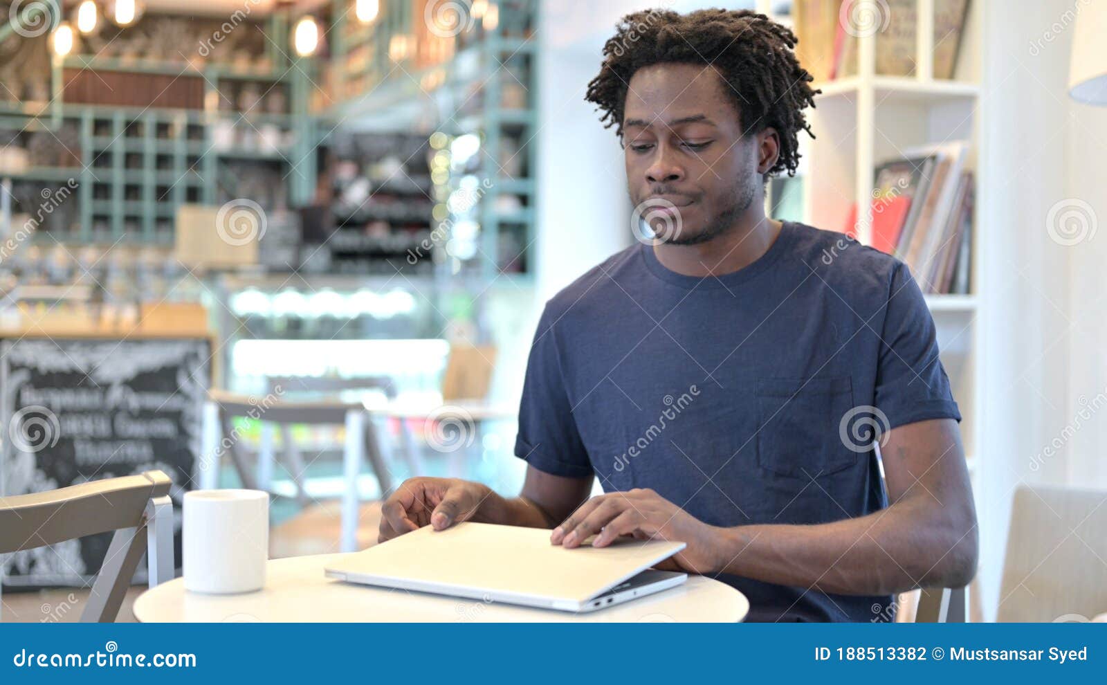 African Man Closing Laptop and Leaving Cafe Stock Photo - Image of ...