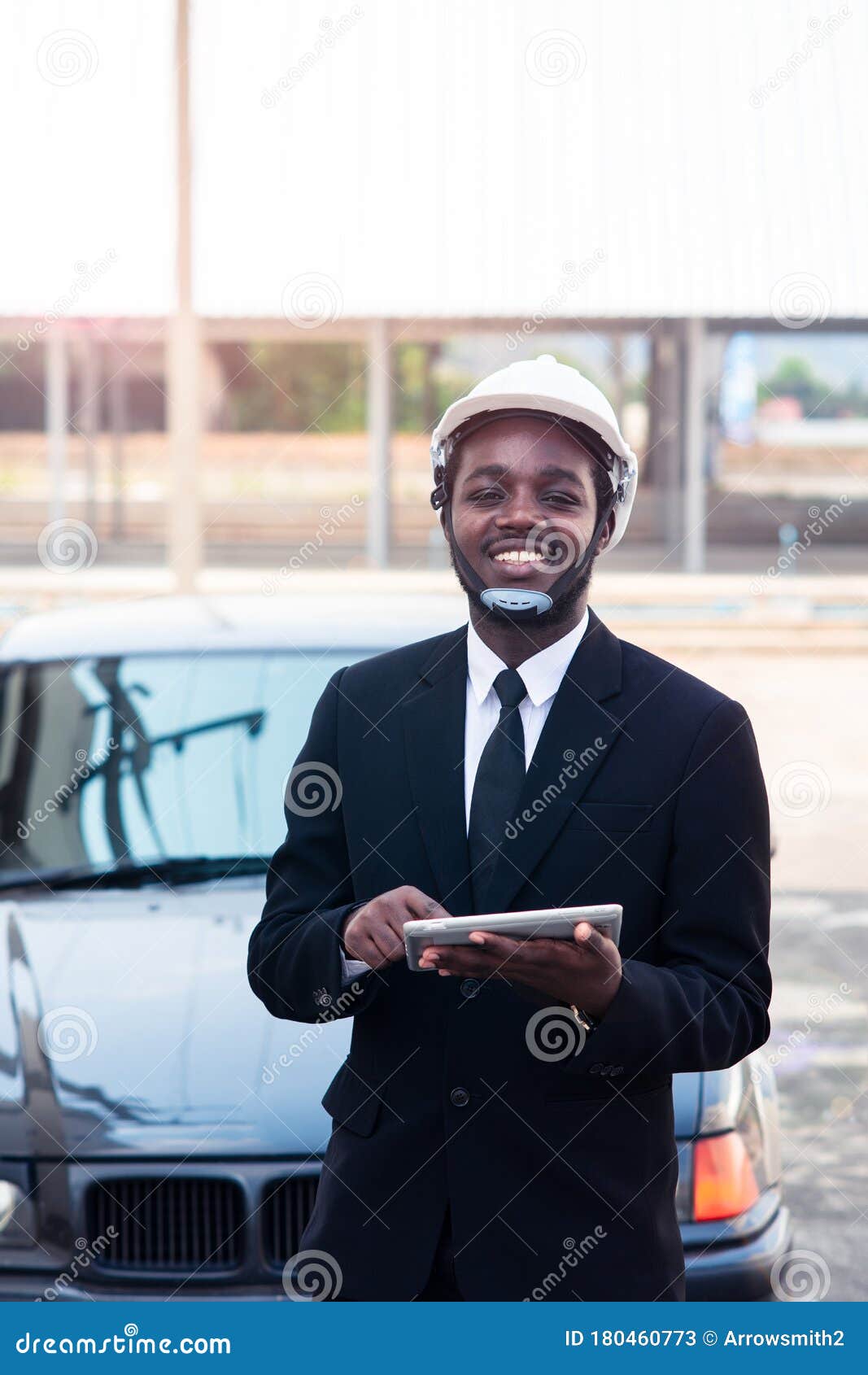 African Man Construction Engineer Worker Standing and Use Teblet with ...