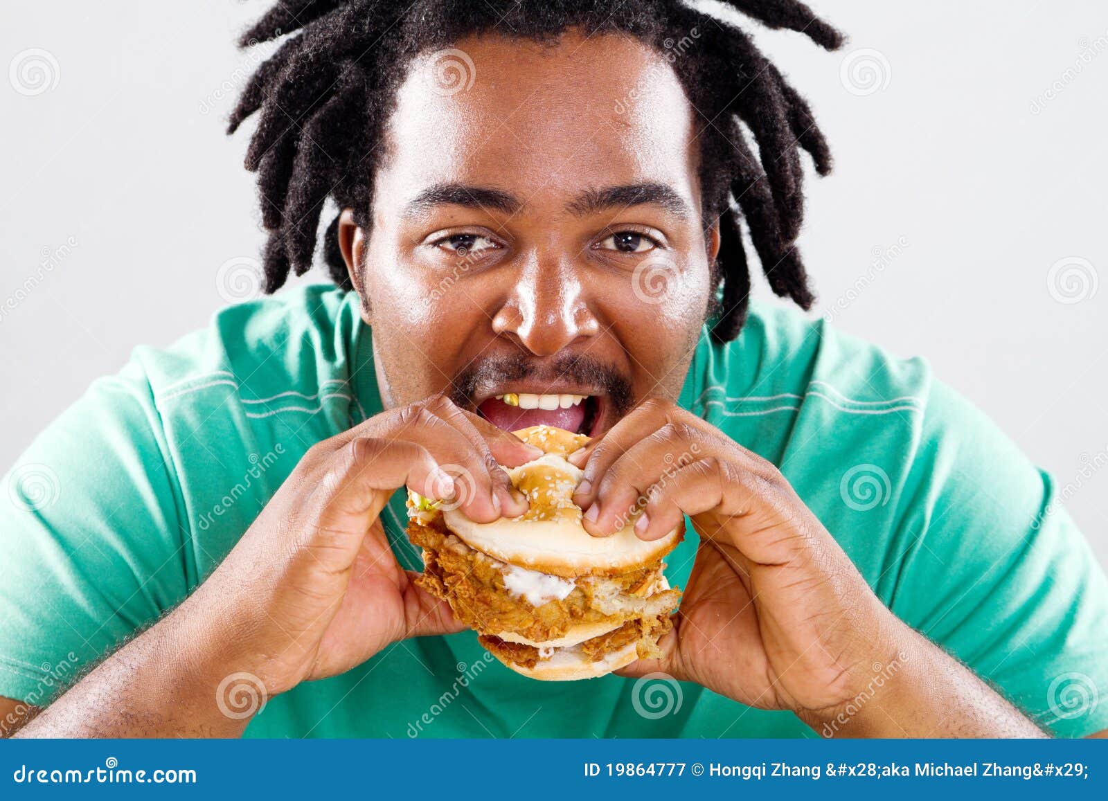 African Man Eating Hamburger Stock Image - Image of fast, holding: 19864777