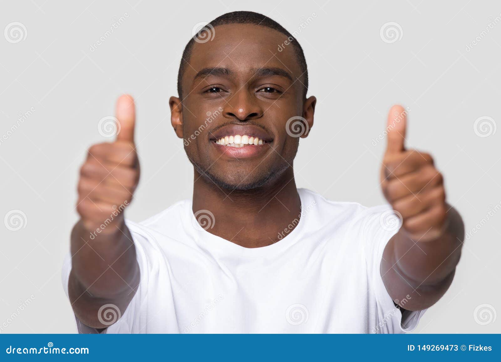 African Man Feels Happy Showing Thumbs Up Looking At Camera Stock Image