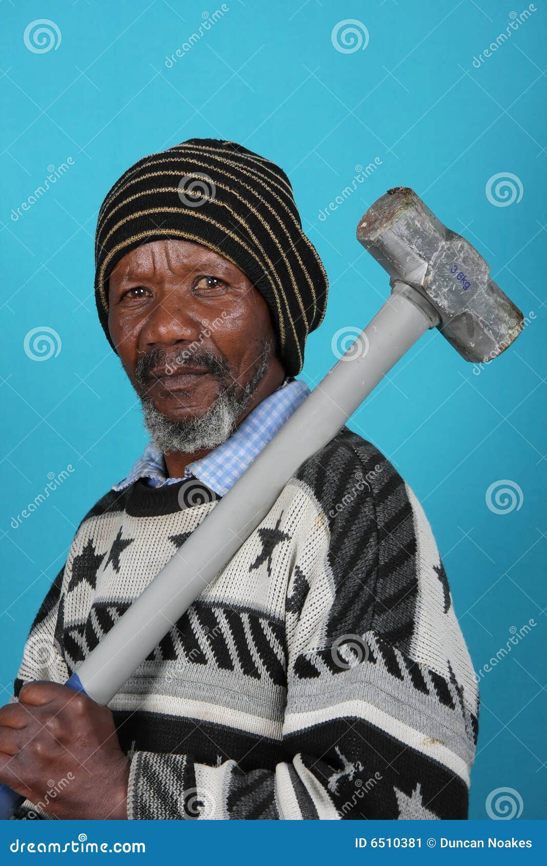 African Man and Hammer stock image. Image of woolen, male - 6510381