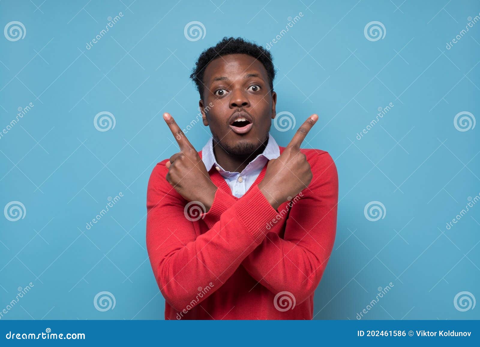 African Man Pointing in Two Different Directions, Not Sure Which Way To ... African Man Pointing in Two Different Directions, Not Sure Which Way To ...