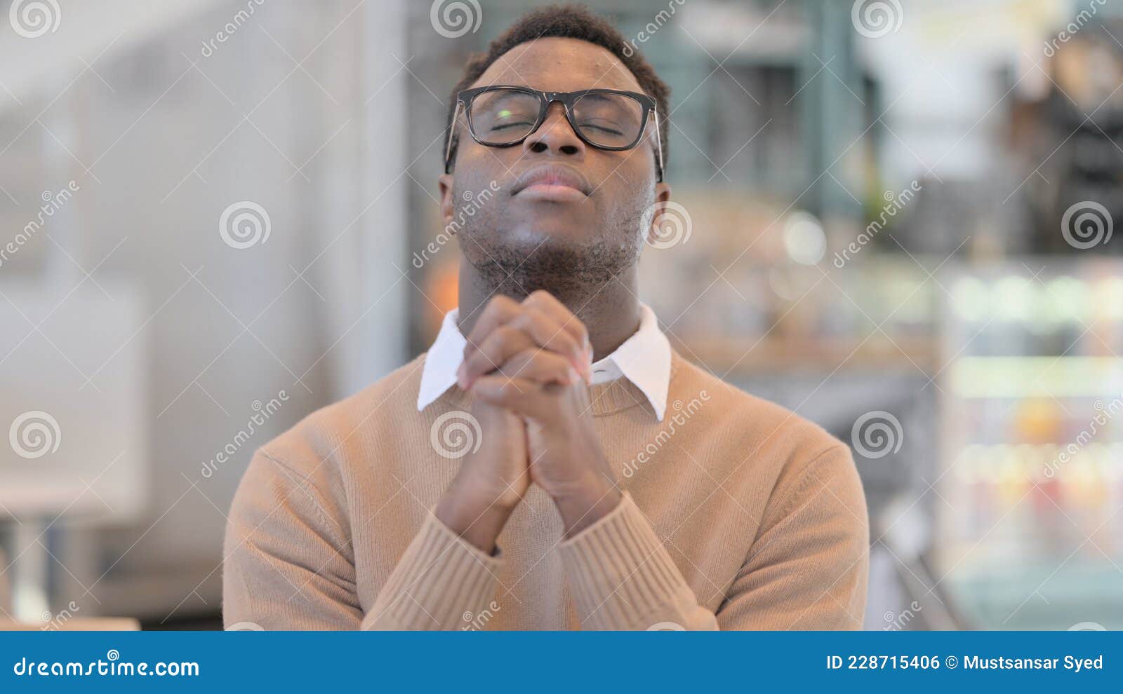 African Man Praying to God stock photo. Image of closeup - 228715406