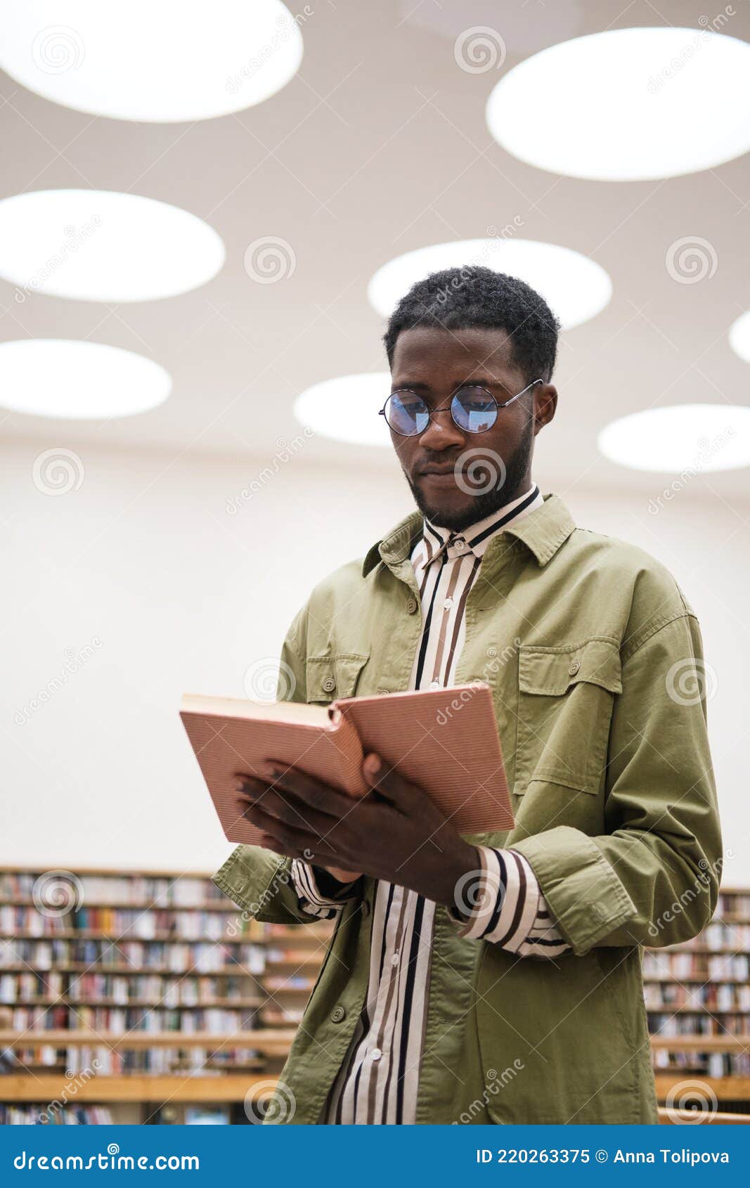African man reading a book stock image. Image of success - 220263375