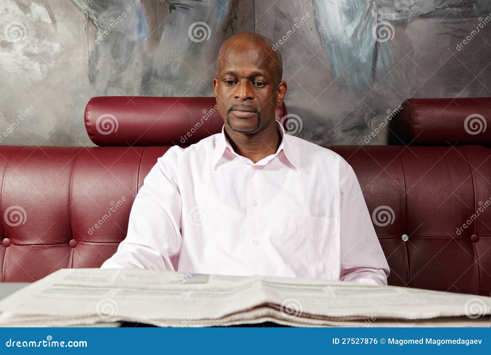 African man reading paper stock photo. Image of information - 27527876