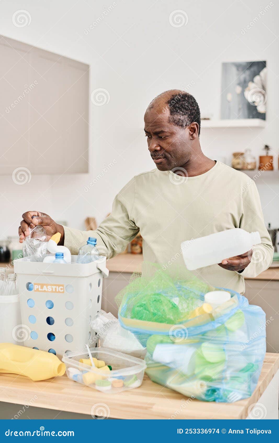 Man Separating Garbage in Containers at Home Stock Photo - Image of ...