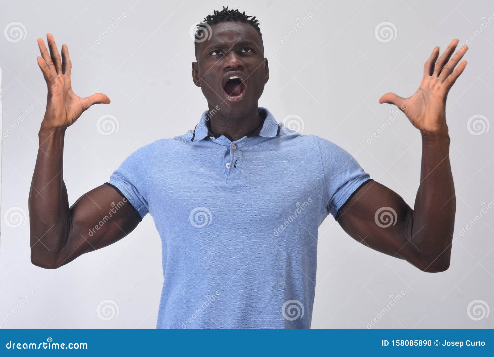 African Man Shouting with Arms Raised Stock Photo - Image of arms ...