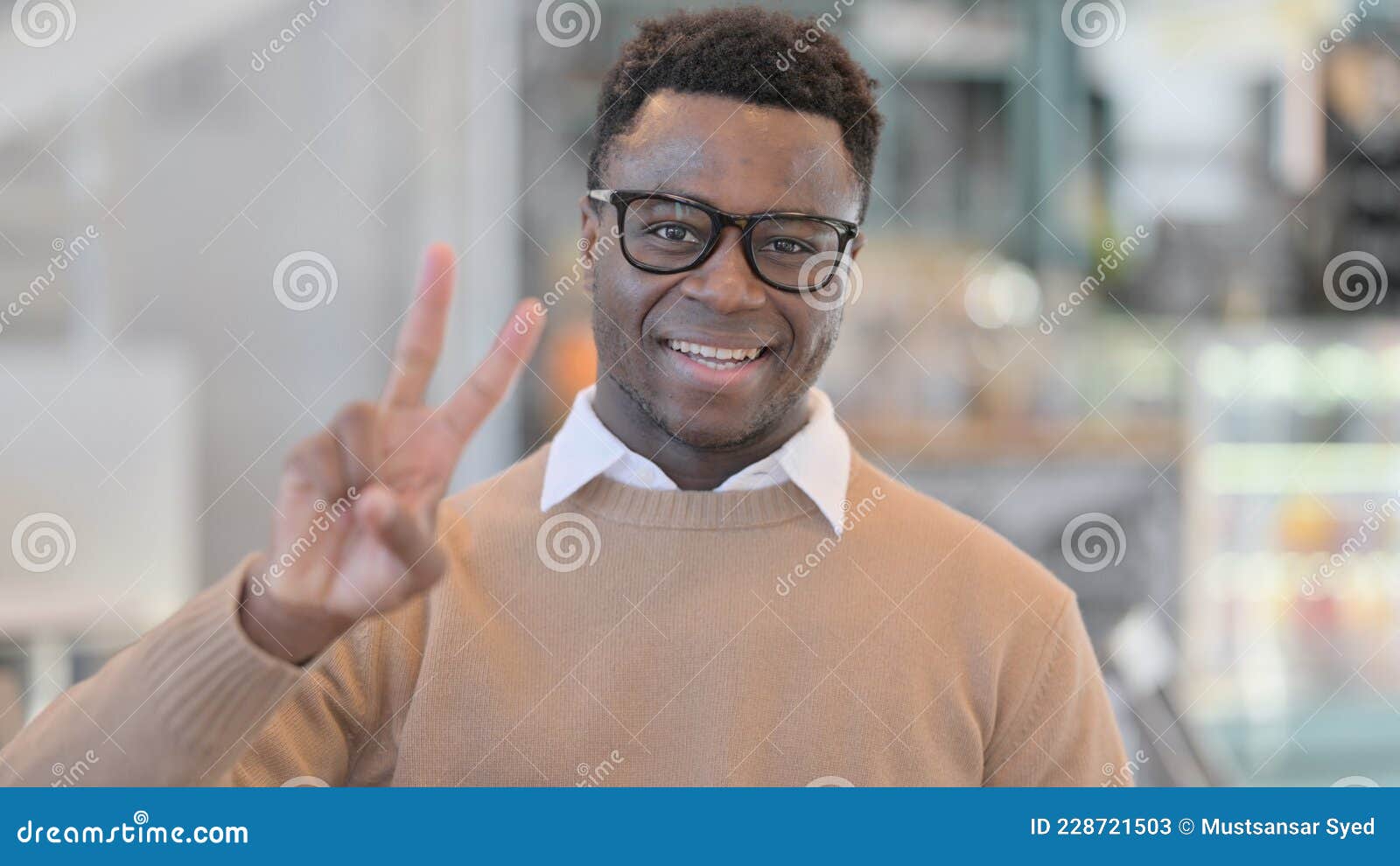 African Man Showing Victory Sign Stock Image - Image of creativity ...