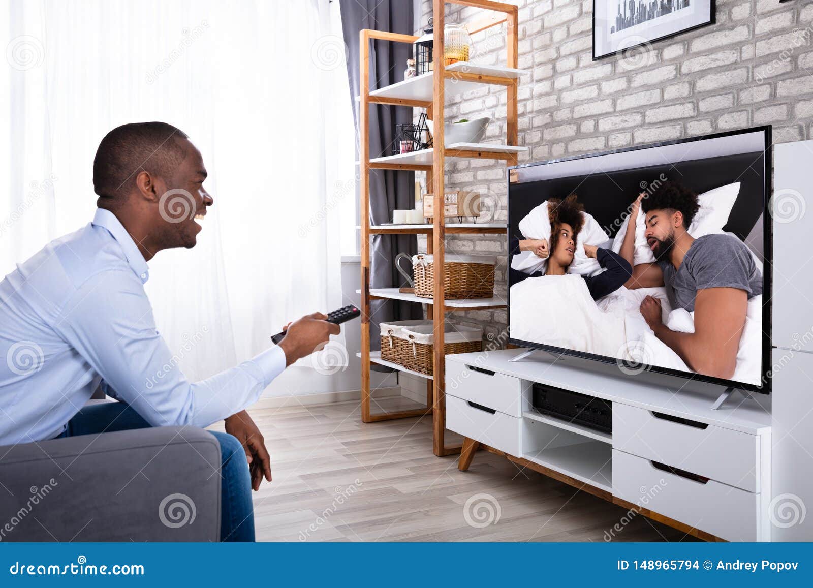 African Man Watching Television at Home Stock Photo - Image of diary ...
