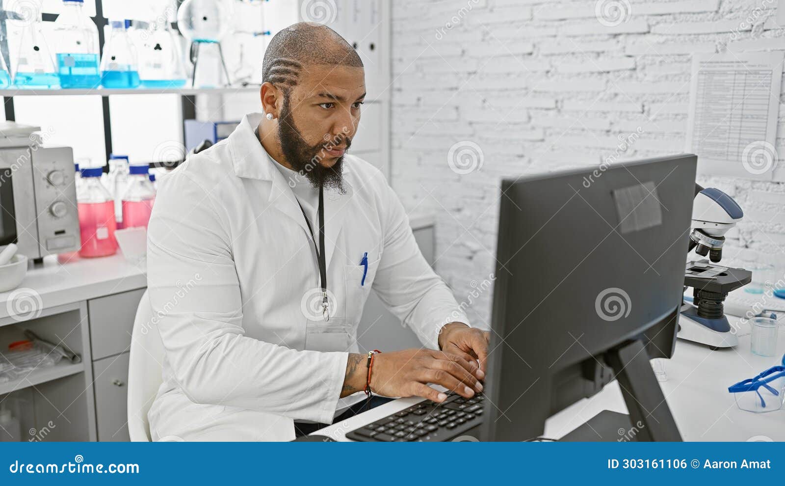 African Man in White Lab Coat Working on Computer in Modern Laboratory ...
