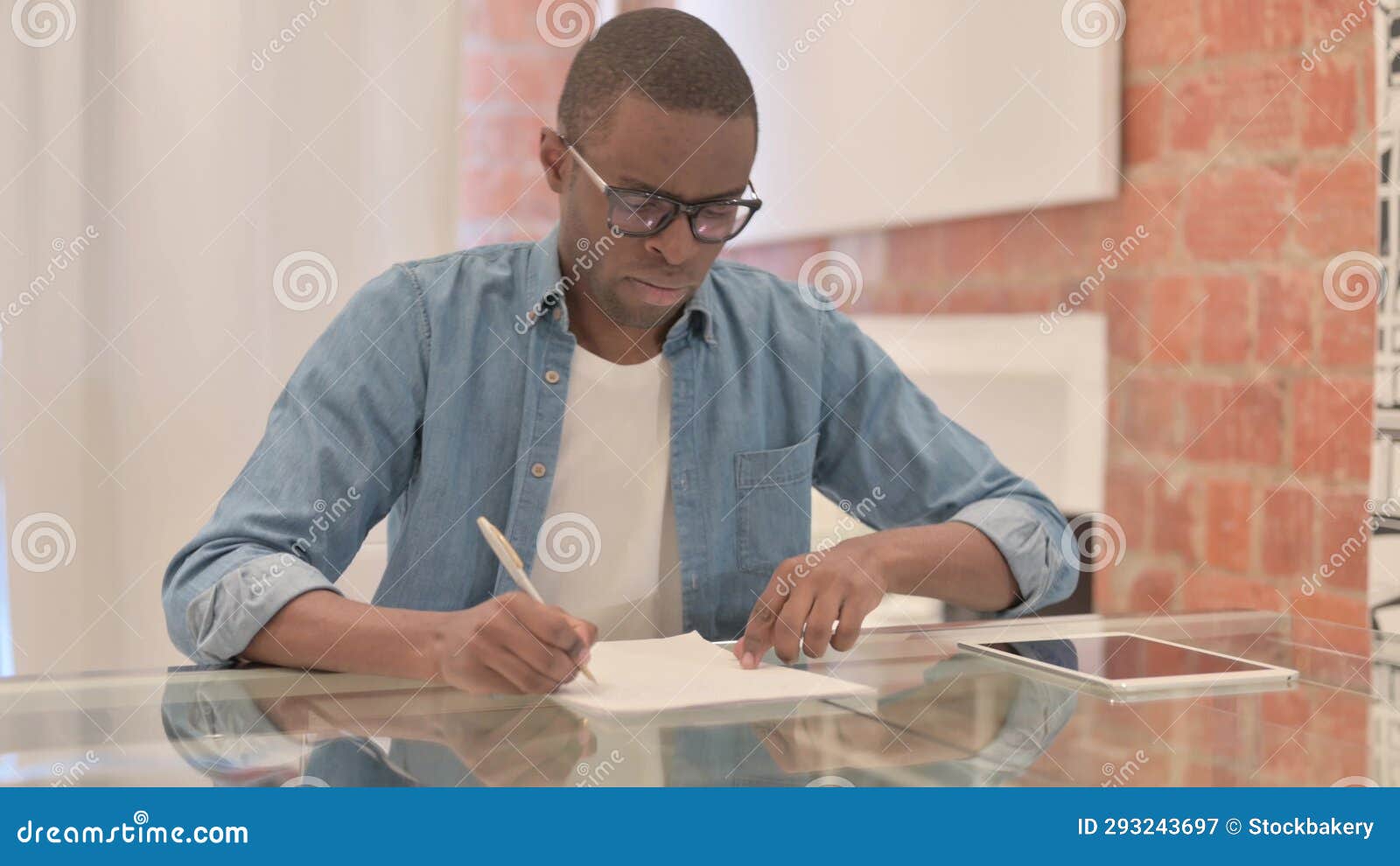 African Man Writing Letter at Work Paperwork Stock Video - Video of ...