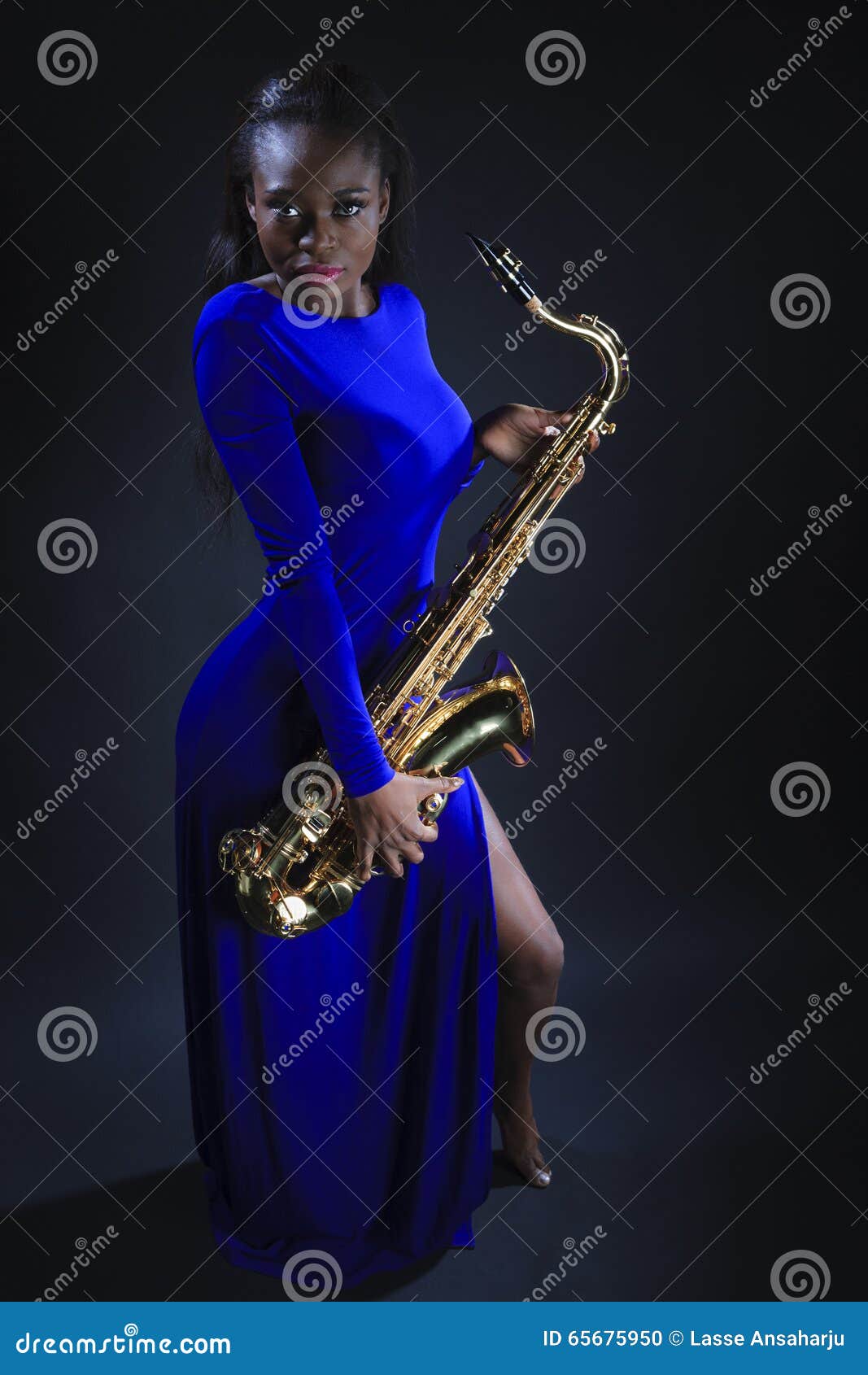 African Sax Lady stock photo. Image of dress, lady, music - 65675950