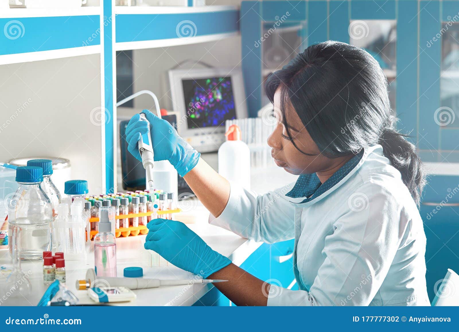 African Scientist or Graduate Student in Lab Coat and Protective Wear ...