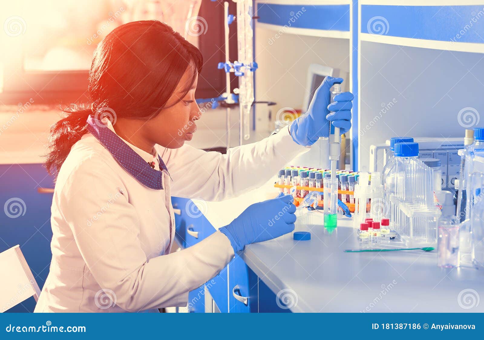 African Scientist or Graduate Student in Lab Coat and Protective Wear ...
