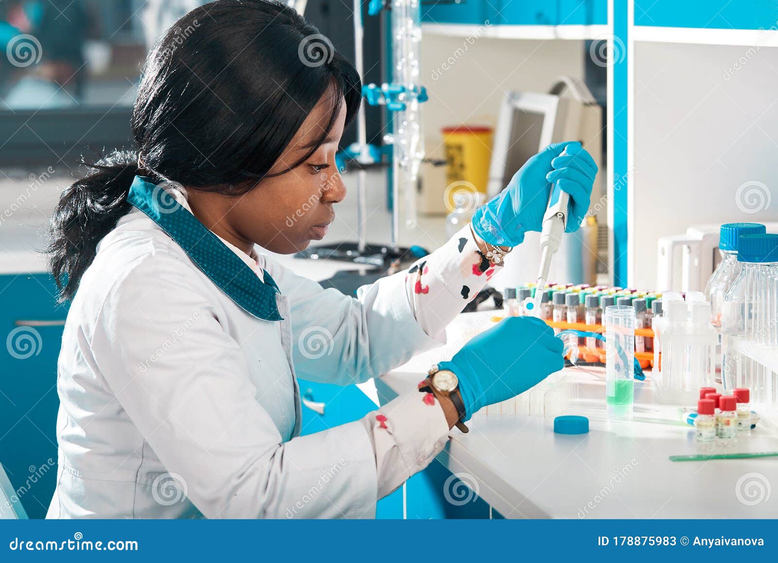 African Scientist or Graduate Student in Lab Coat and Protective Wear ...