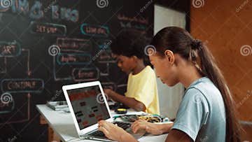 African Student Fixing Main Board while Smart Girl Coding Prompt ...