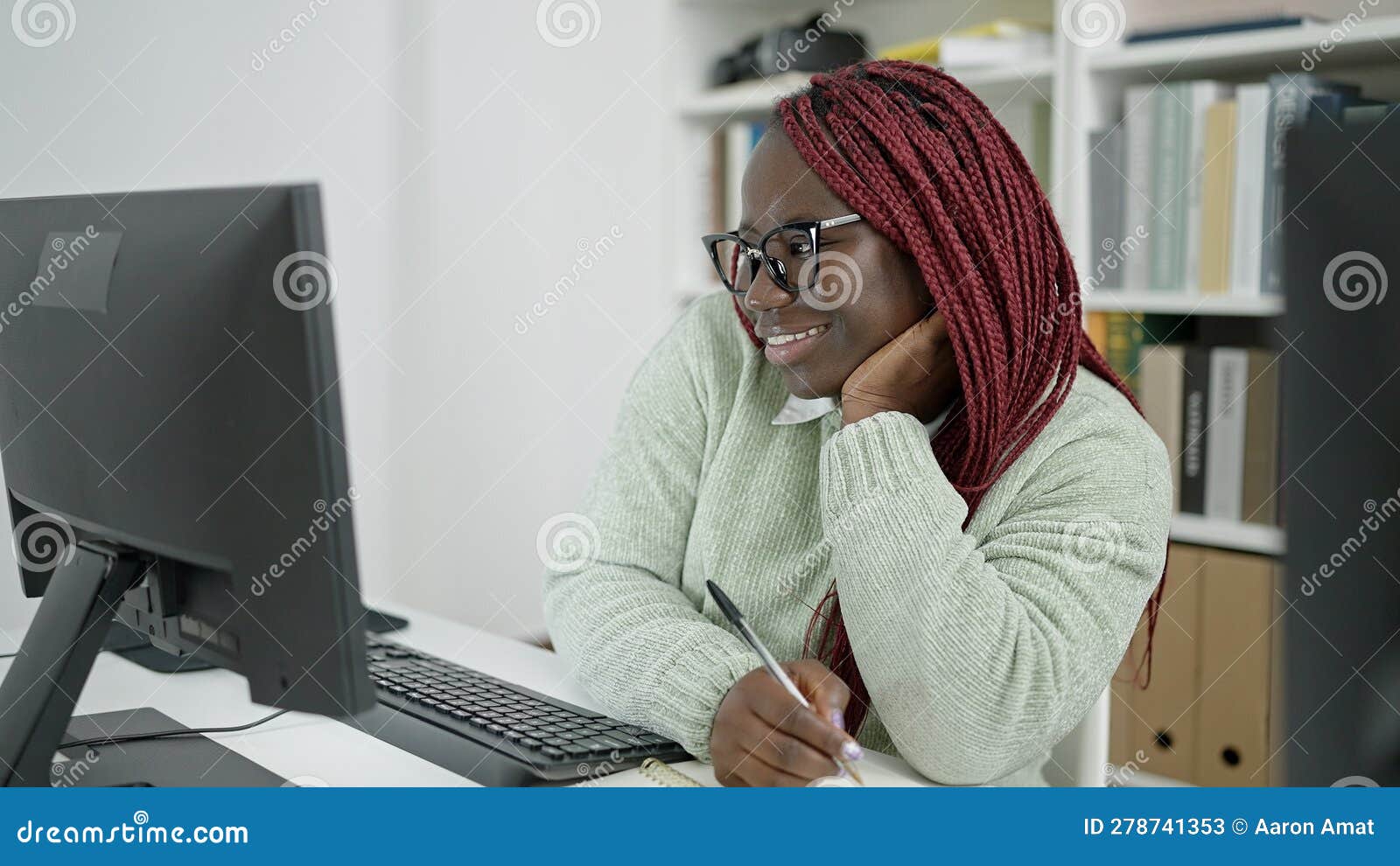 African Woman with Braided Hair Student Using Computer Writing on ...