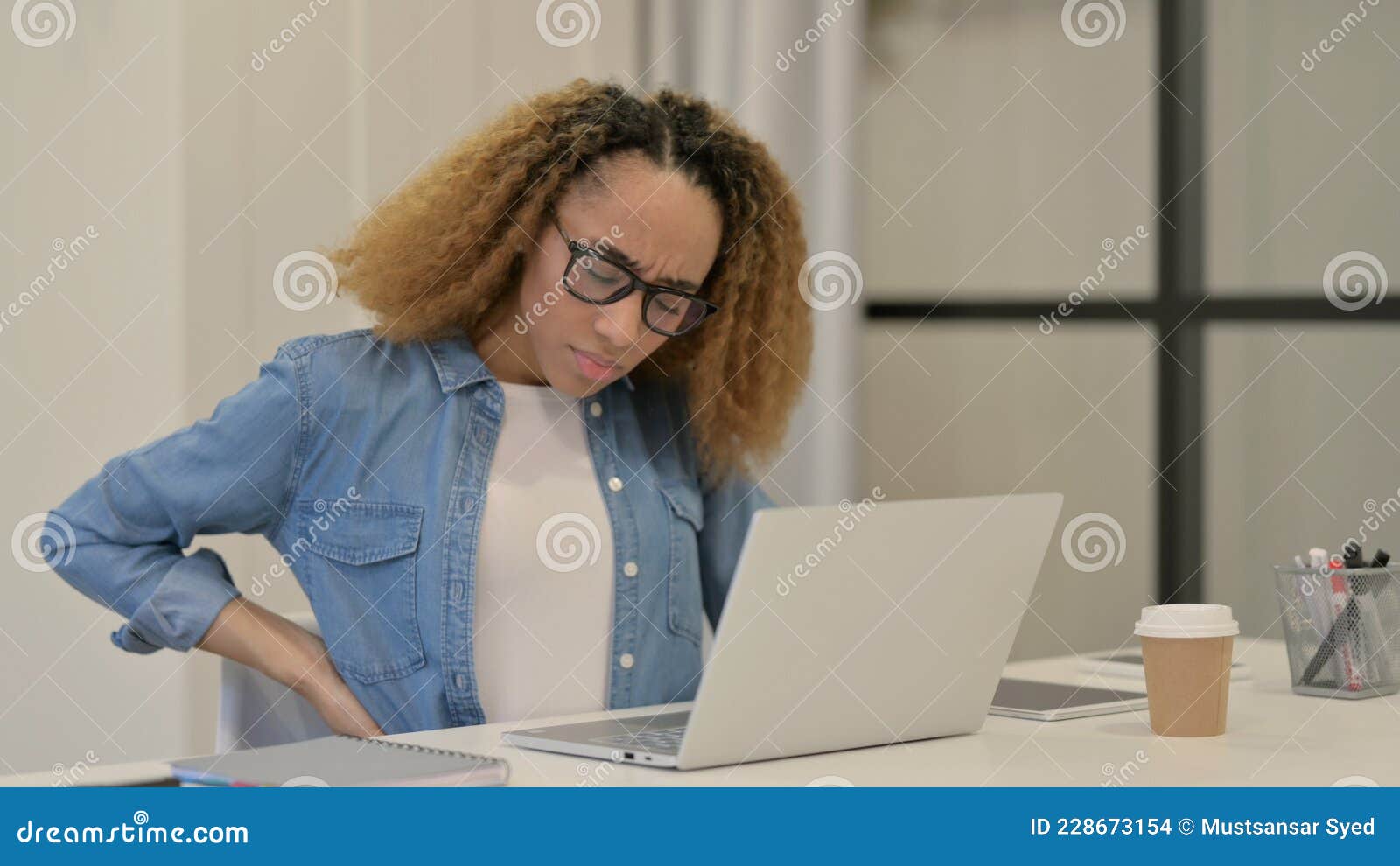 African Woman Having Back Pain while Using Laptop Stock Photo - Image ...
