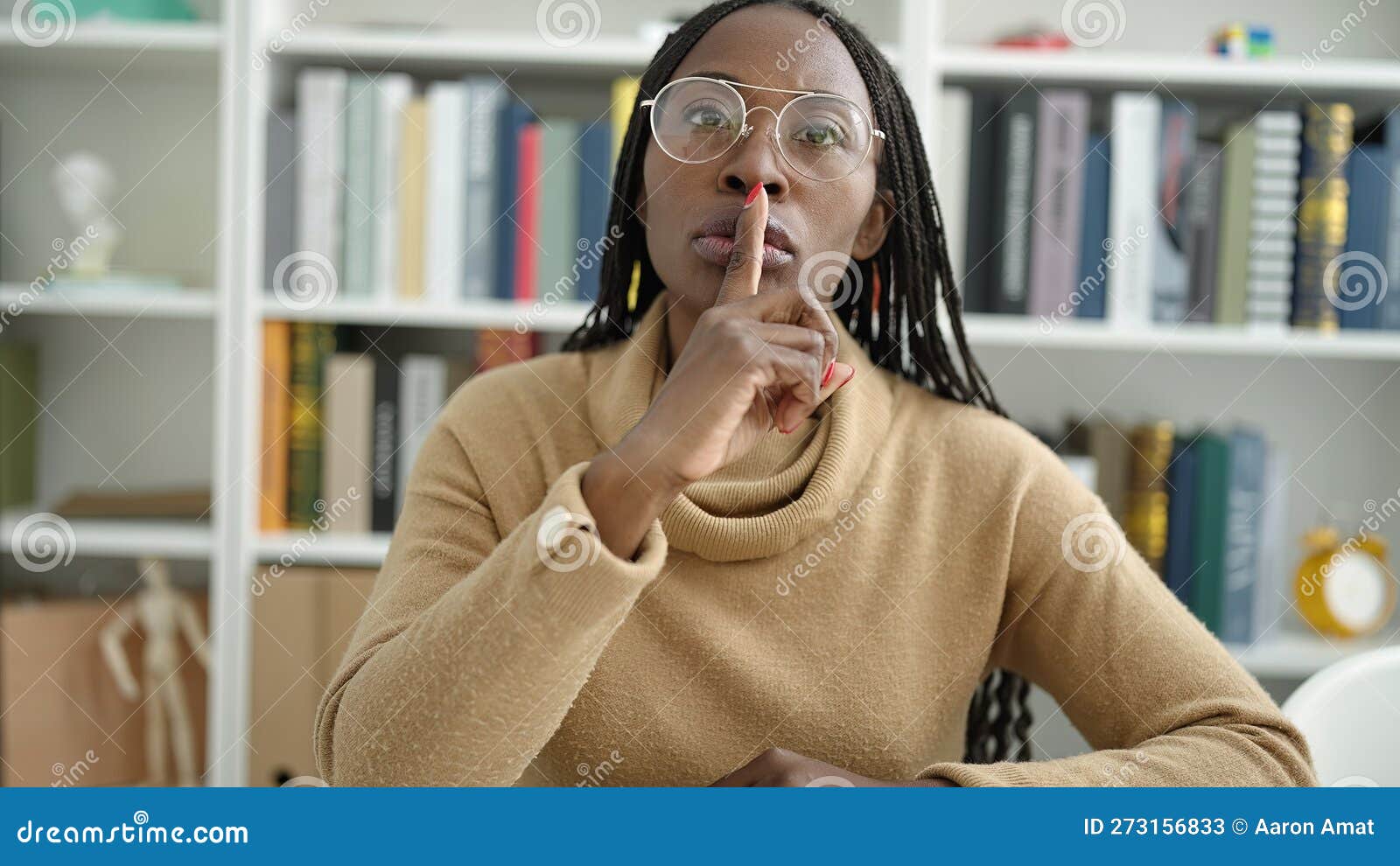 African Woman Reading a Book Asking for Silence at Library University ...