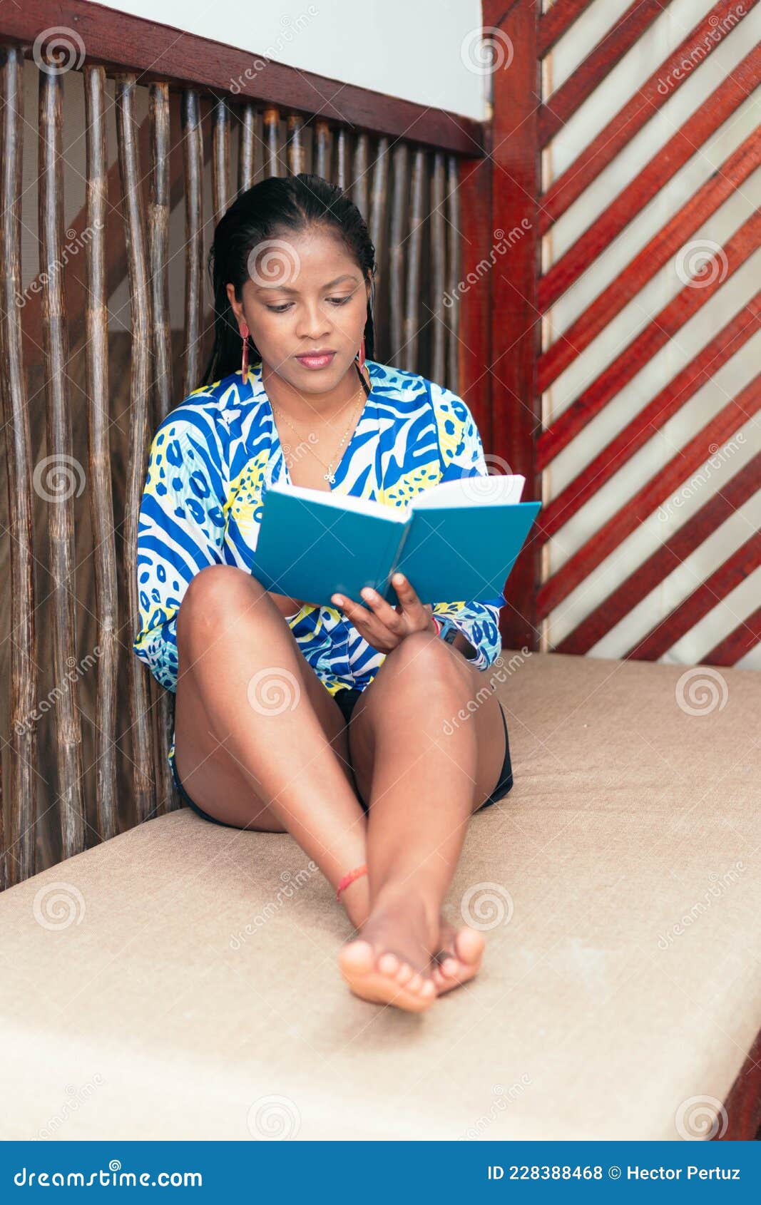 African Woman Reading a Book at Home Stock Photo - Image of chair ...