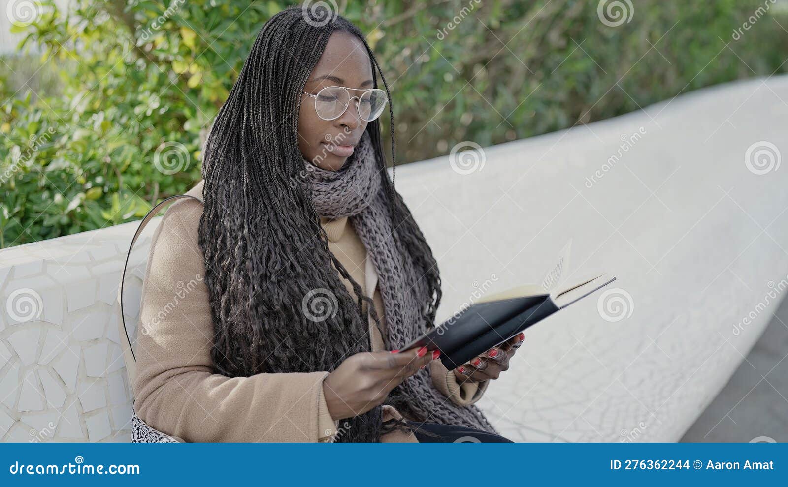 African Woman Reading a Book at Park Stock Photo - Image of ...