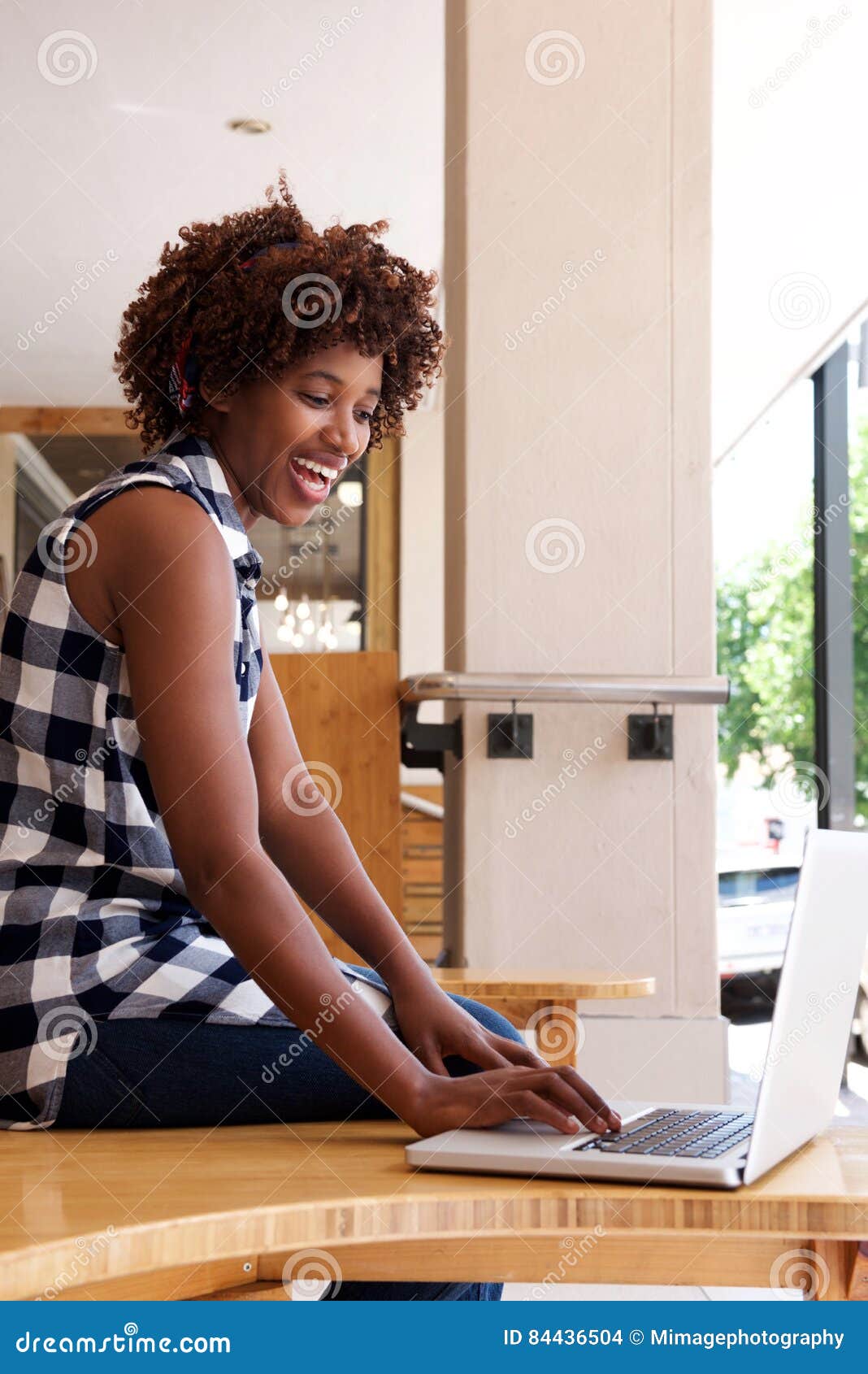 African Woman Smiling with Laptop Computer Stock Photo - Image of ...