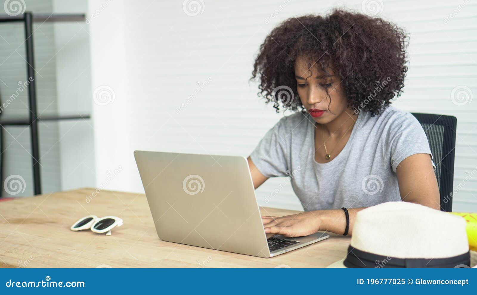 African Woman Working from Home Serious Business on Notebook Stock ...