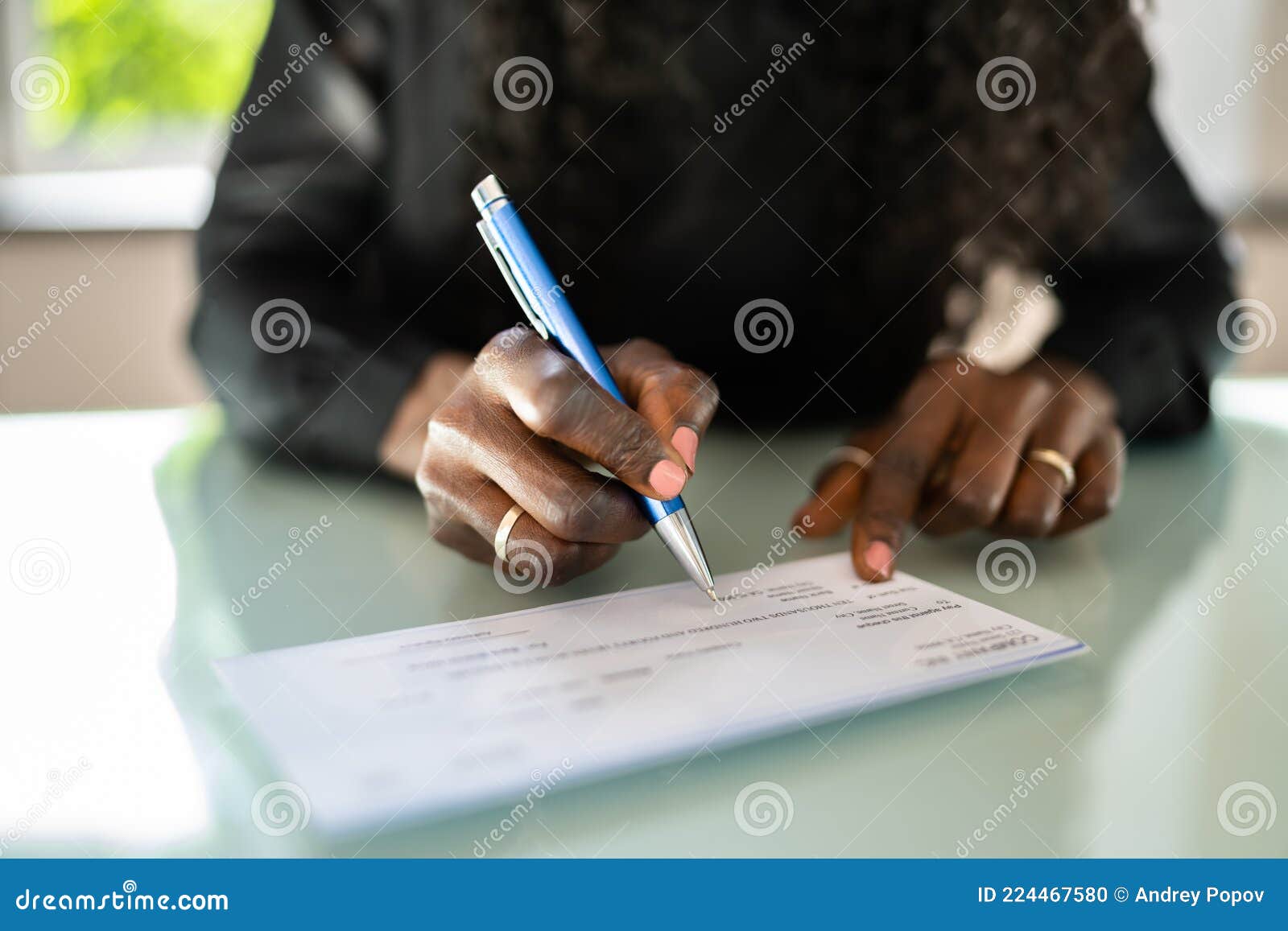 African Woman Writing Check Stock Photo - Image of paper, dollar: 224467580