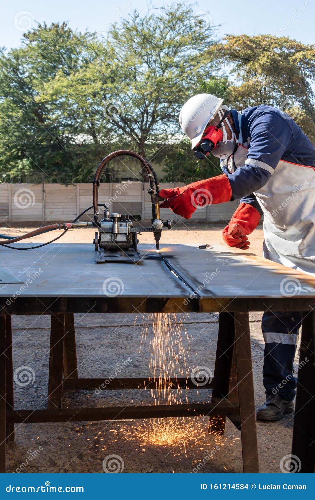 African Worker with a Cutting Torch Stock Photo - Image of cutting ...
