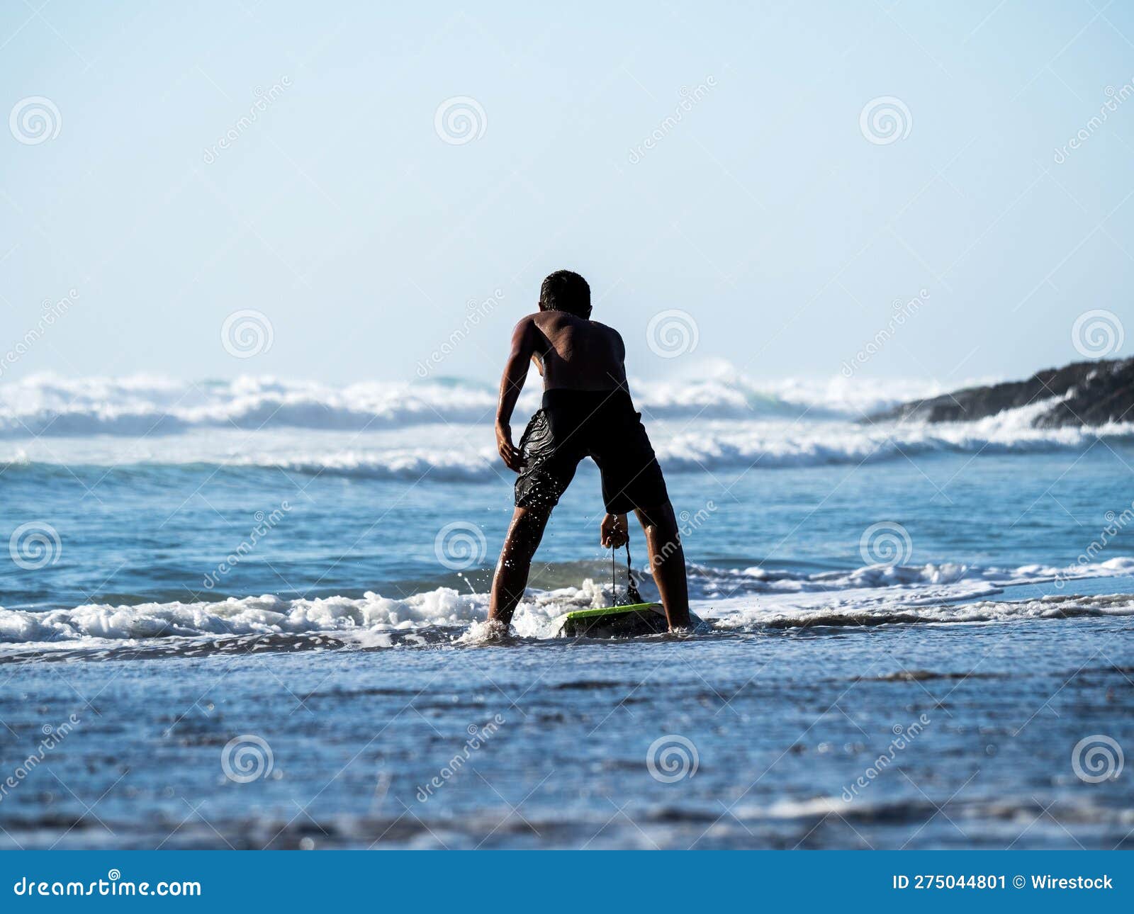 African Young Man Riding a Surfboard in the Ocean Waves. Stock Image ...