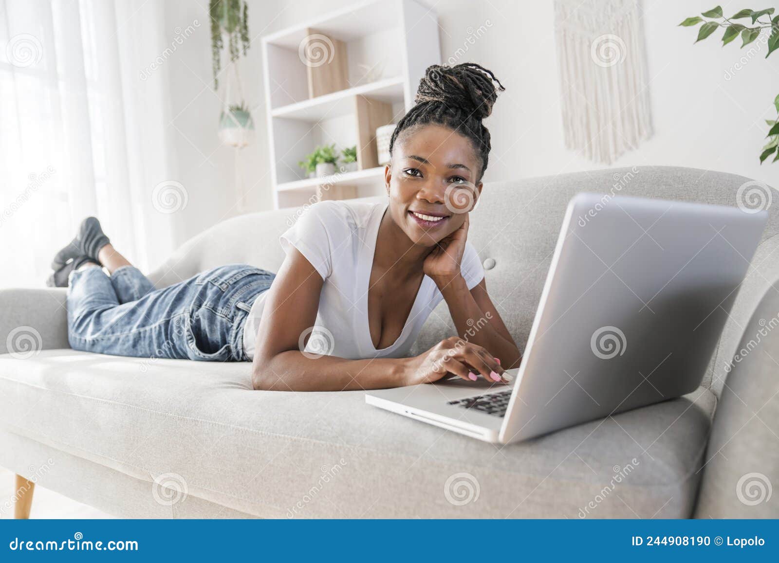 African Young Woman Relaxing at Home Sofa Stock Photo - Image of ...