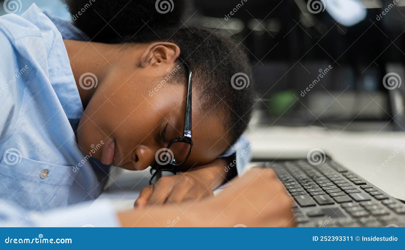 African Young Woman Sleeping at Work Desk. Stock Image - Image of ...