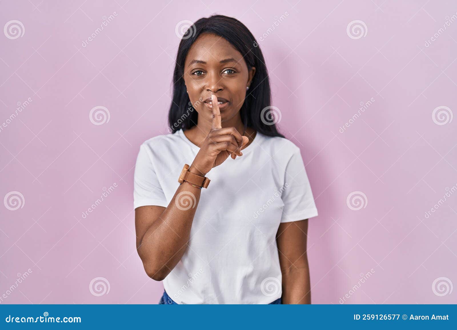 African Young Woman Wearing Casual White T Shirt Asking To Be Quiet