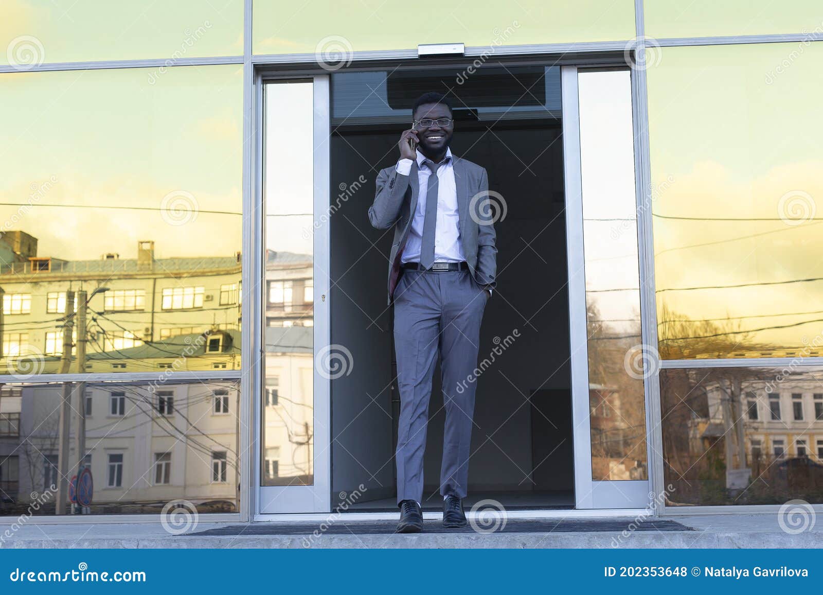Afro American Man Walks Out of Building Happy Stock Photo - Image of ...