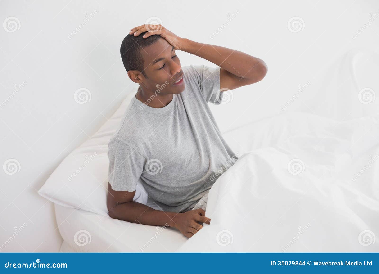 Afro Man Waking Up with Eyes Closed in Bed Stock Photo - Image of awake ...