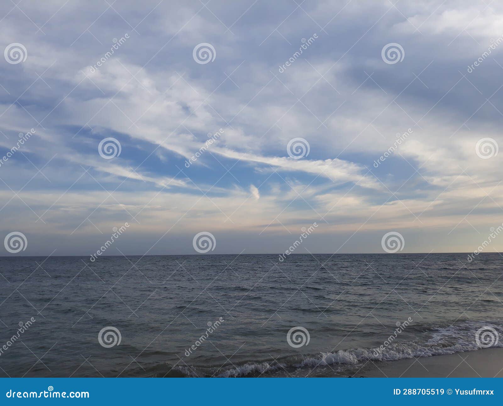 Afternoon Beach with a Reddish Cloud Swirl Stock Image - Image of ...