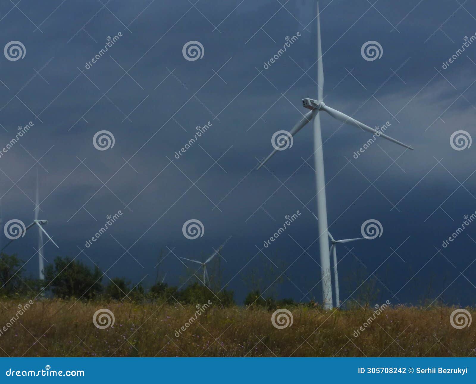 Against the Background of a Dark Stormy Sky, Wind Generators in the ...