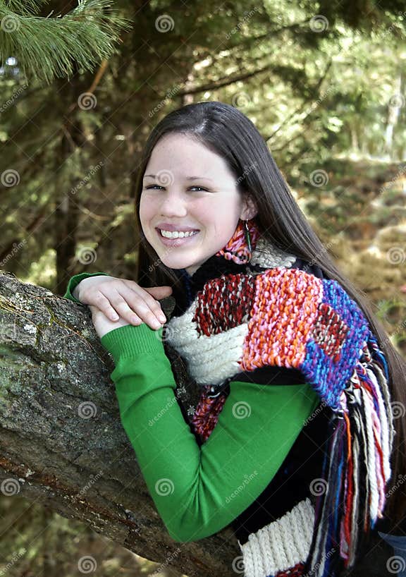 Against a Tree Trunk stock image. Image of girl, radiant - 20162517