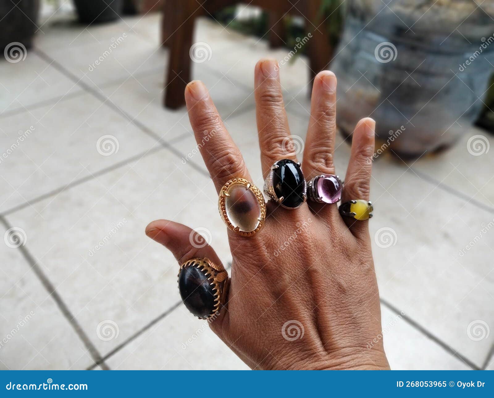 Agate Ring on the Finger of Five Beautiful Hands Stock Image - Image of ...