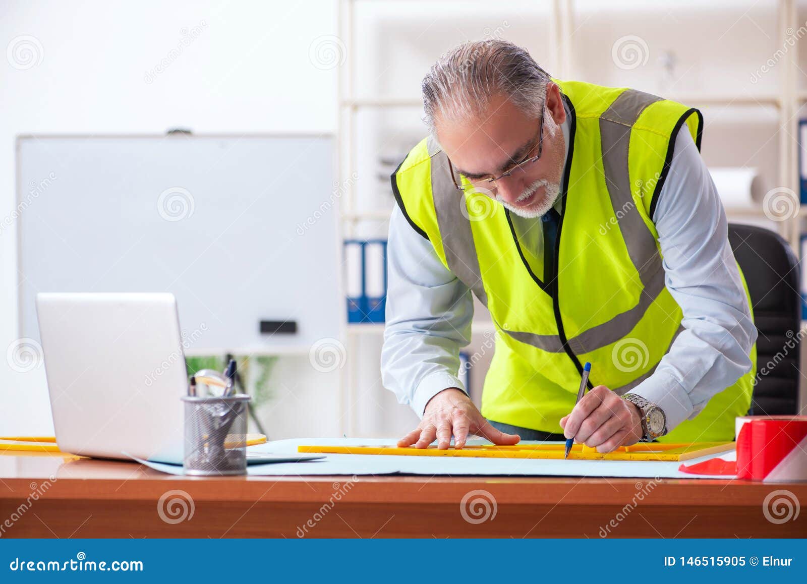 The Aged Construction Engineer Working in the Office Stock Image ...