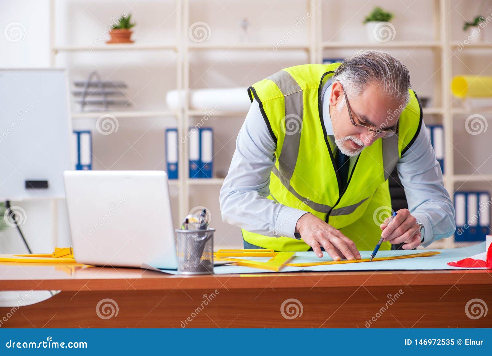 The Aged Construction Engineer Working in the Office Stock Image ...