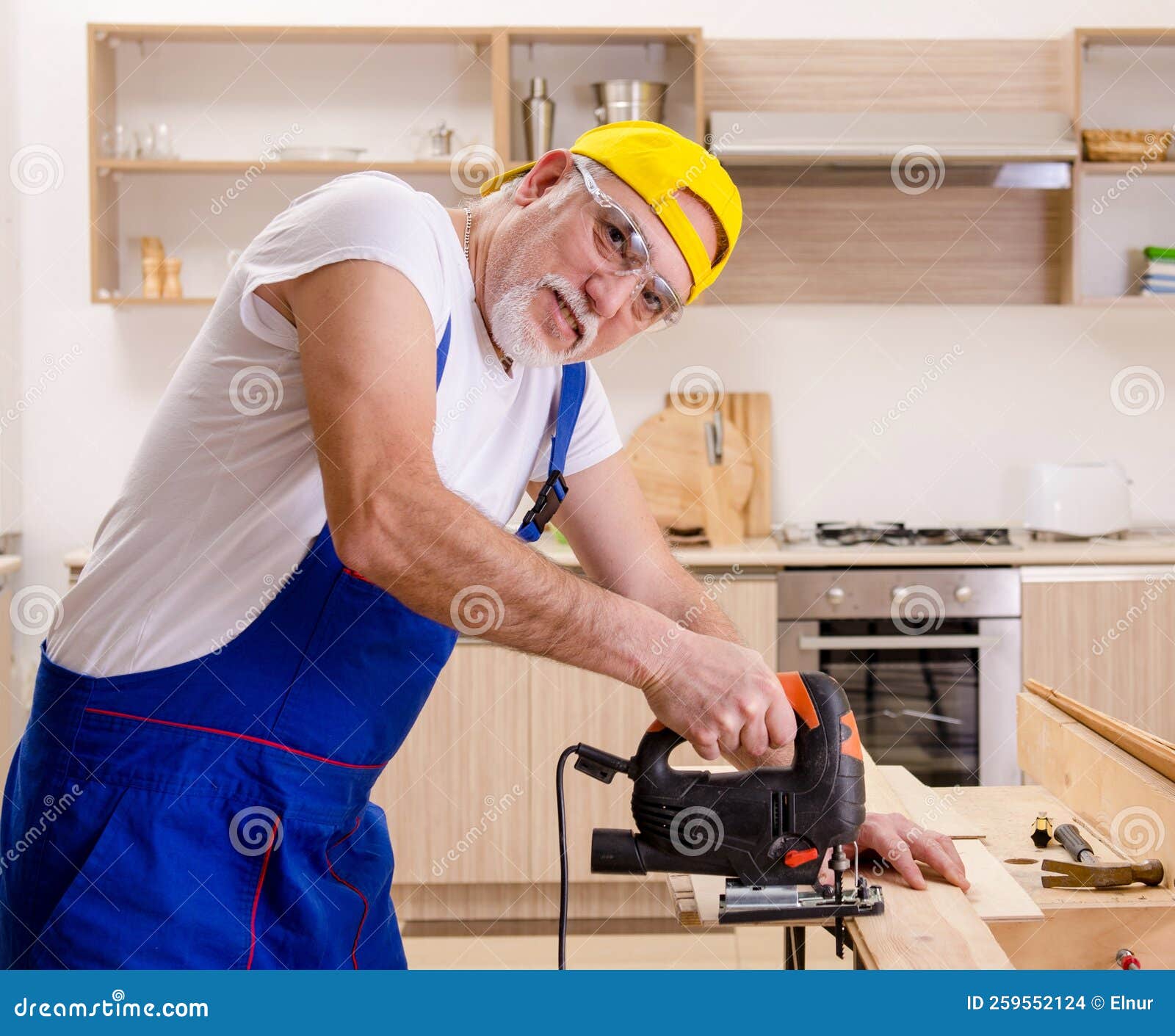 Aged Contractor Repairman Working in the Kitchen Stock Photo - Image of ...