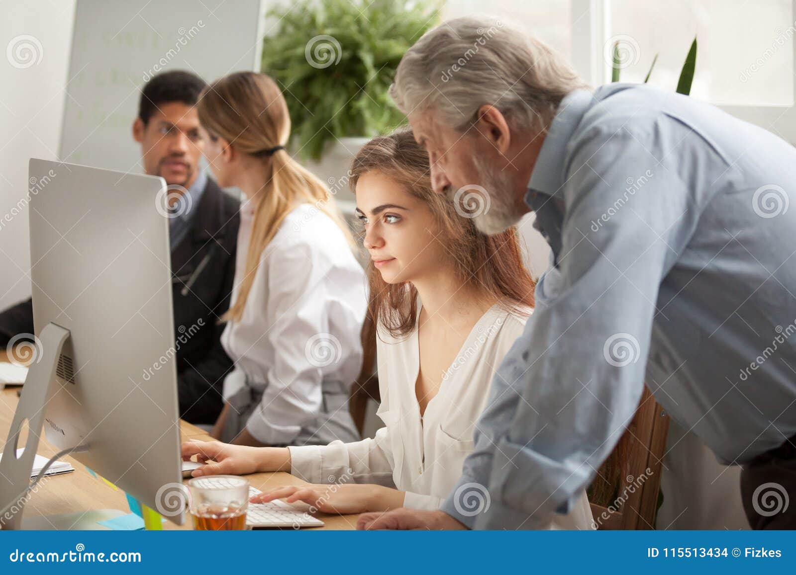 Aged Executive Manager Supervising Computer Work of Intern in of Stock ...