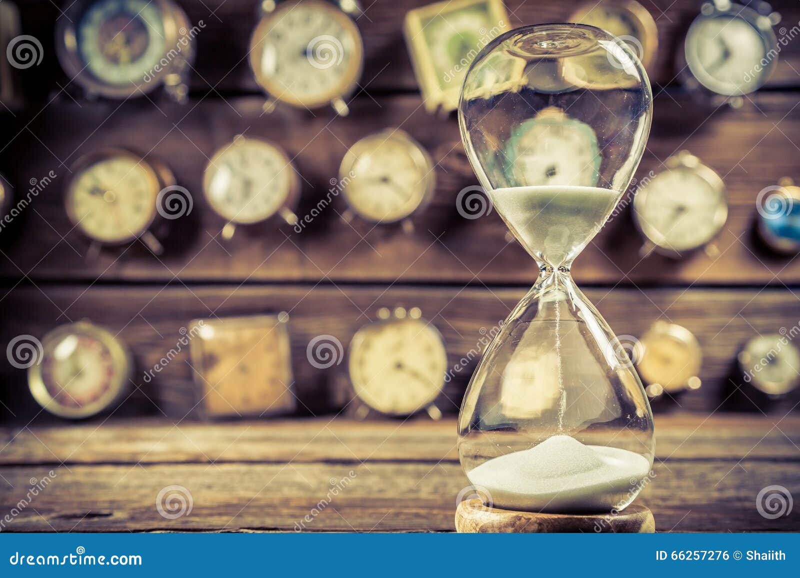 Aged Hourglass on the Background of Clocks Stock Photo - Image of ...
