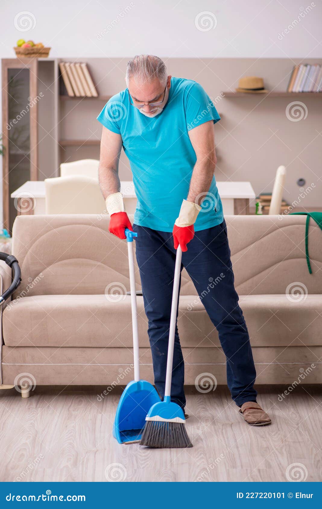 Old man cleaning the house stock image. Image of chores - 227220101