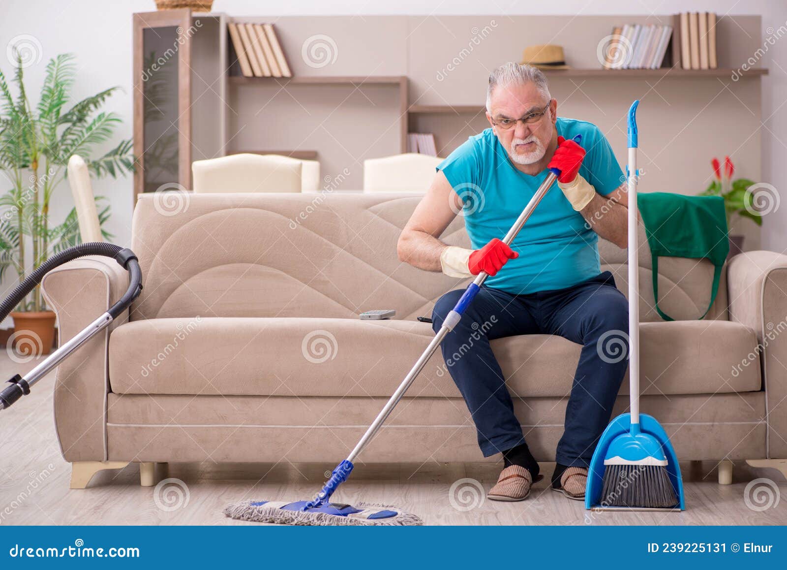 Old man cleaning the house stock image. Image of routine - 239225131